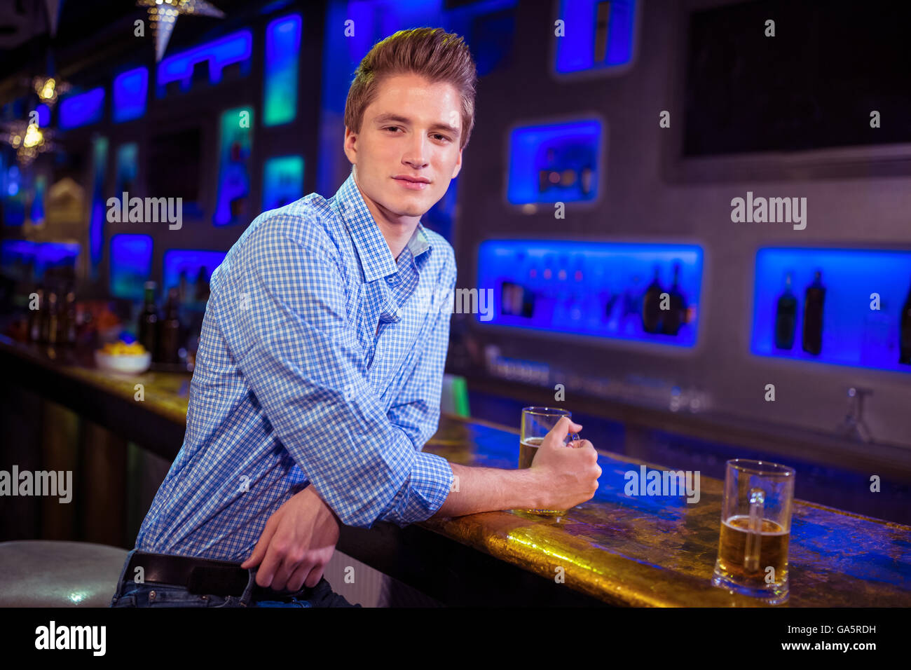 Portrait of man at bar counter Stock Photo - Alamy