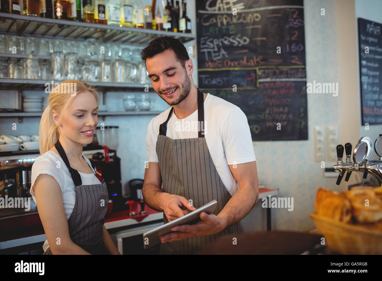 Male female co workers using hi-res stock photography and images - Alamy