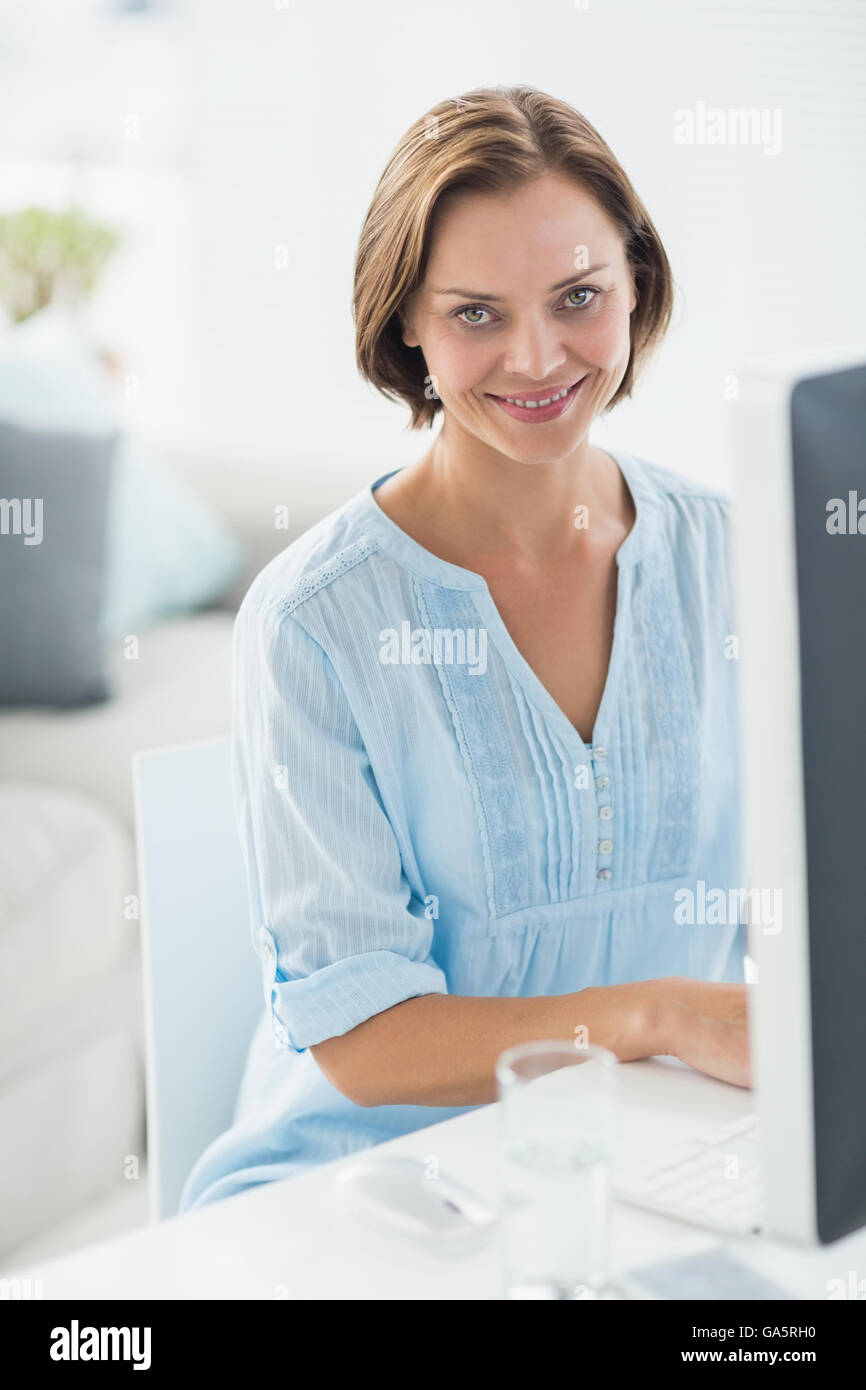 Portrait of smiling woman working Stock Photo - Alamy