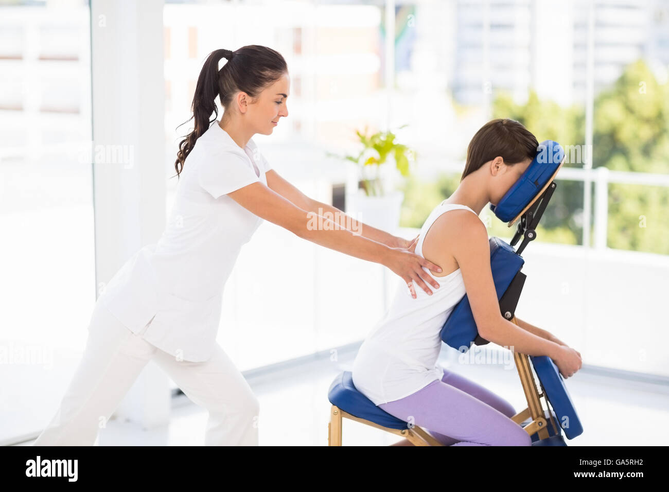 Beautiful woman being massaged hi-res stock photography and images - Alamy
