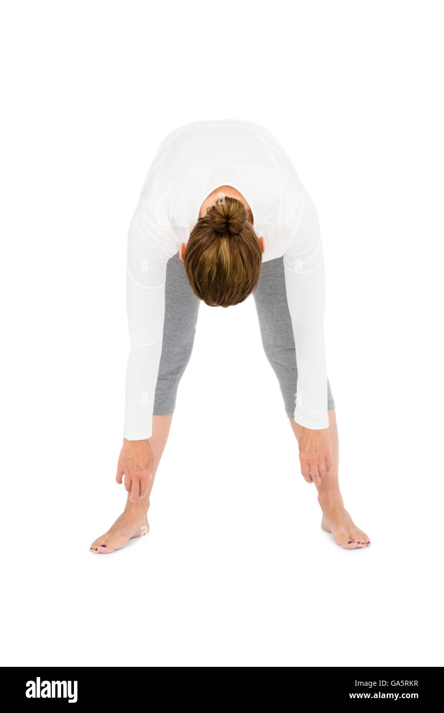 Full length of woman bending while exercising Stock Photo - Alamy