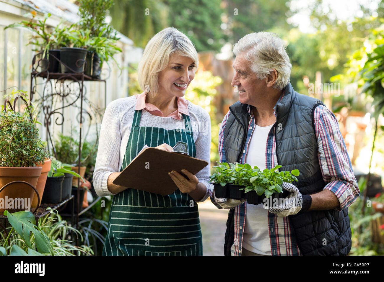 Couple smiling while working Stock Photo - Alamy Couple smiling while working Stock Photo - Alamy