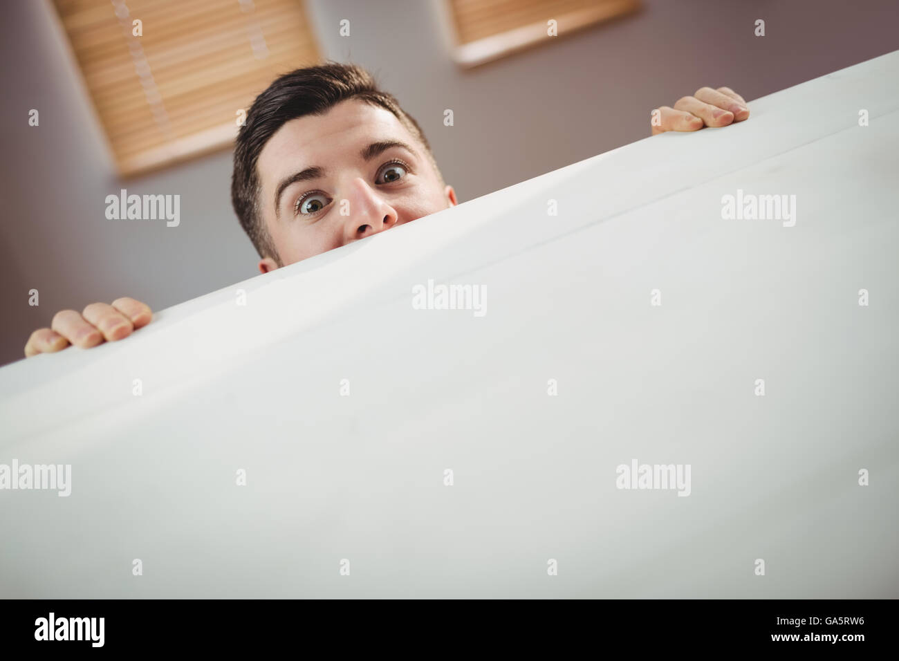 Portrait of man behind table Stock Photo - Alamy