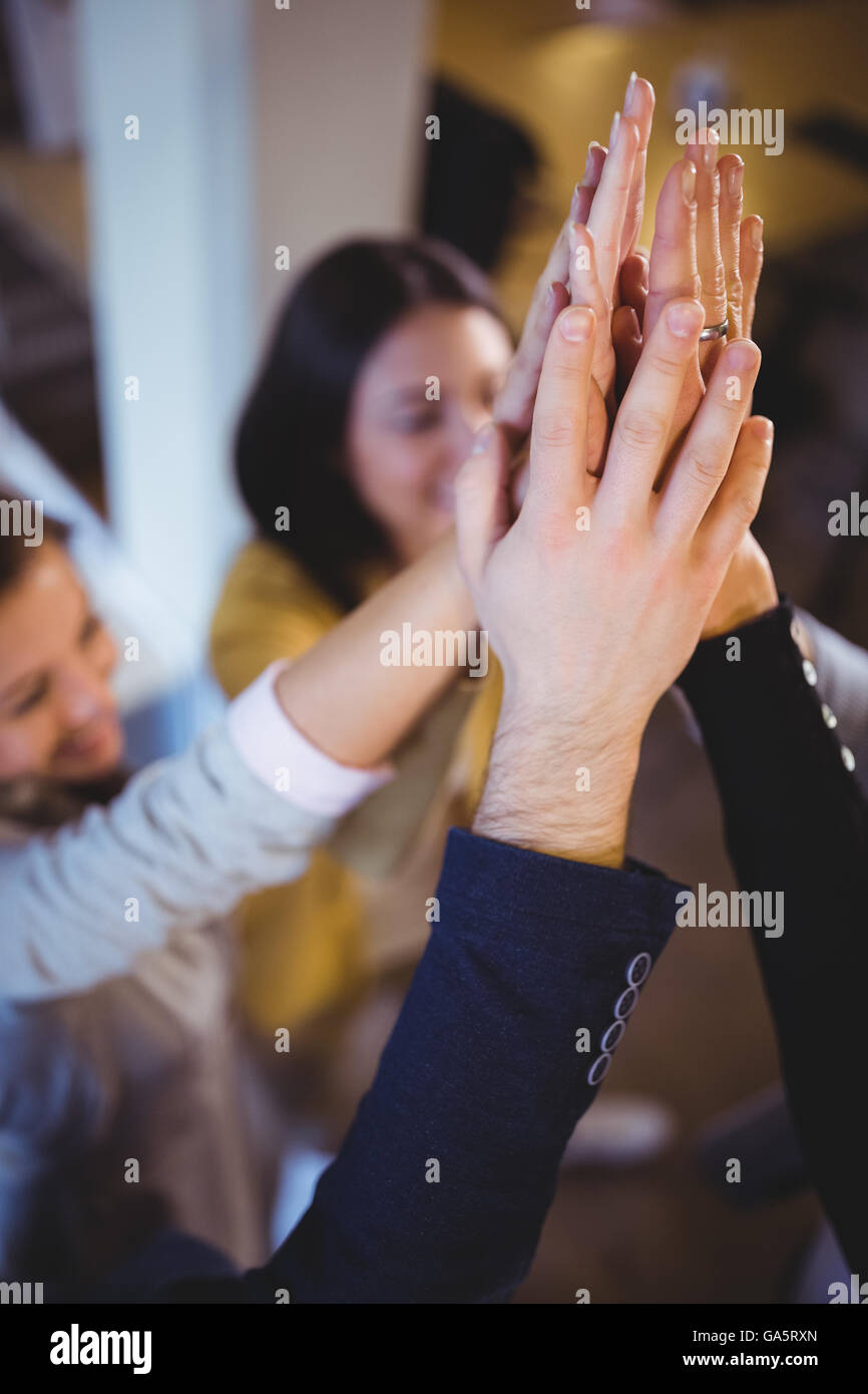 Professional colleagues high fiving hi-res stock photography and images ...