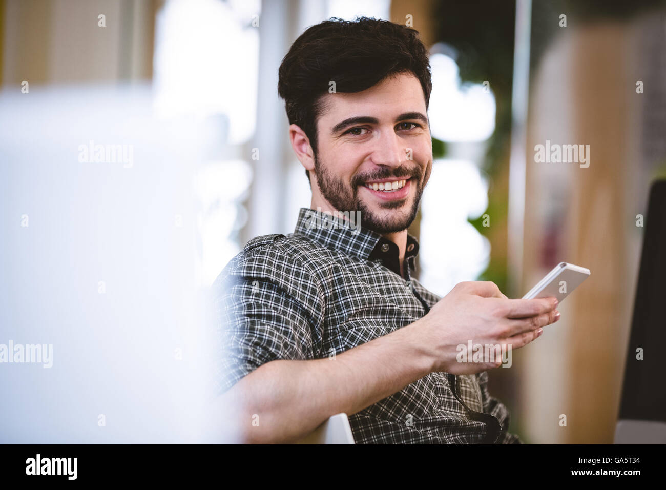 Happy businessman using mobile phone Stock Photo - Alamy