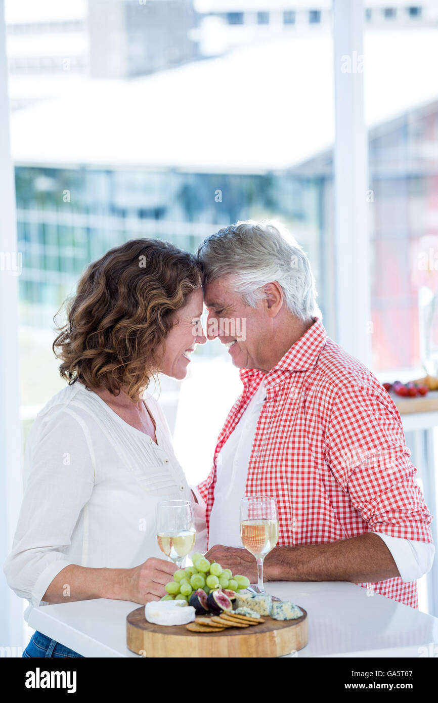 Romantic couple standing at restaurant Stock Photo - Alamy