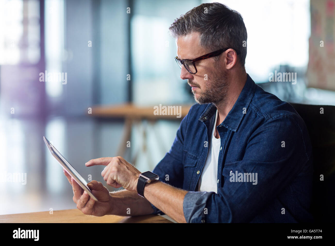 Man using digital tablet Stock Photo - Alamy