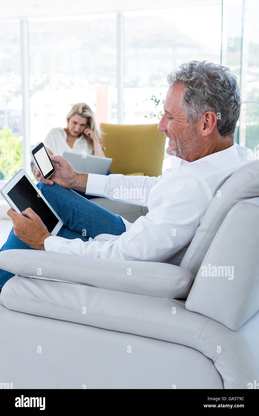 Smiling man using technology Stock Photo - Alamy