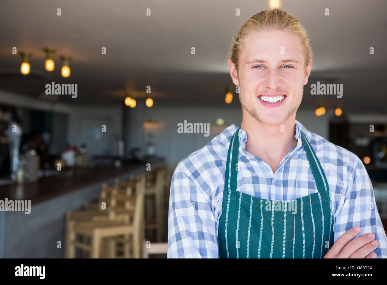 Portrait of waiter smiling Stock Photo - Alamy