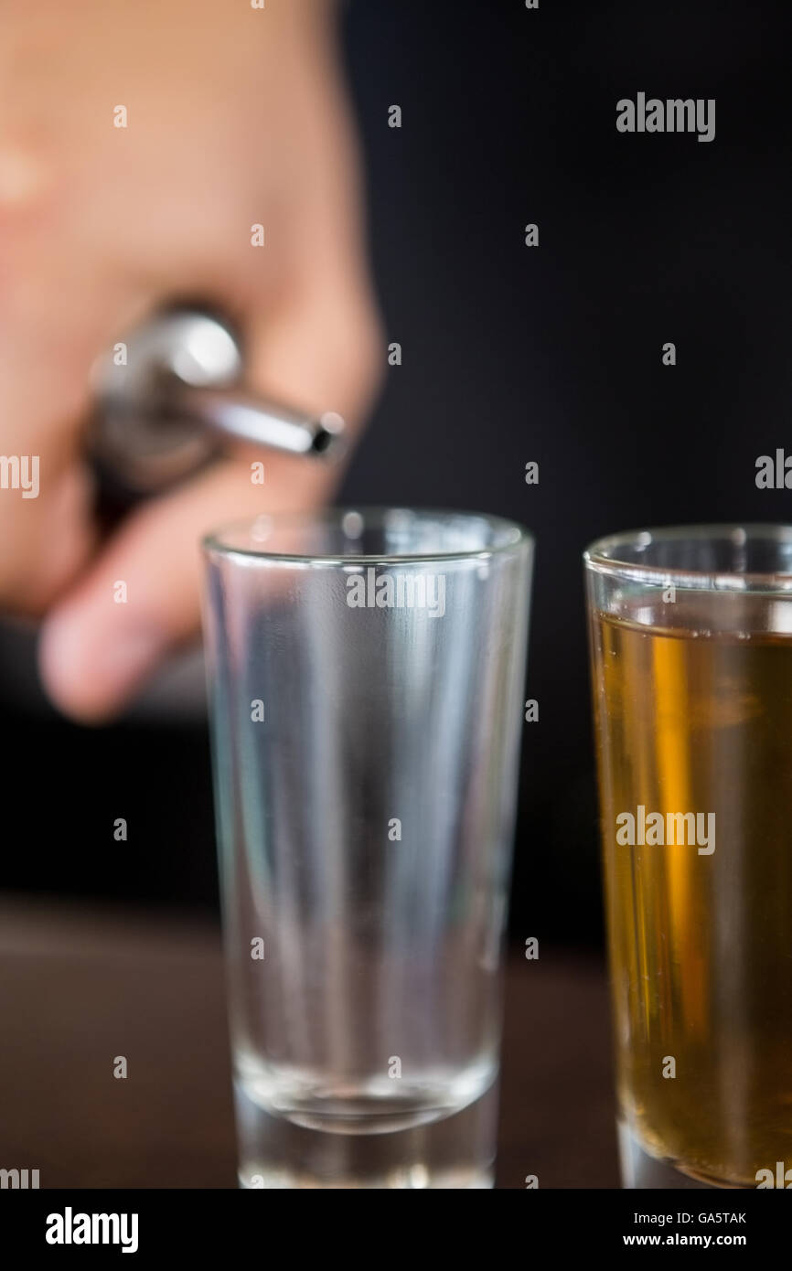 Waiter making shots at bar counter Stock Photo - Alamy