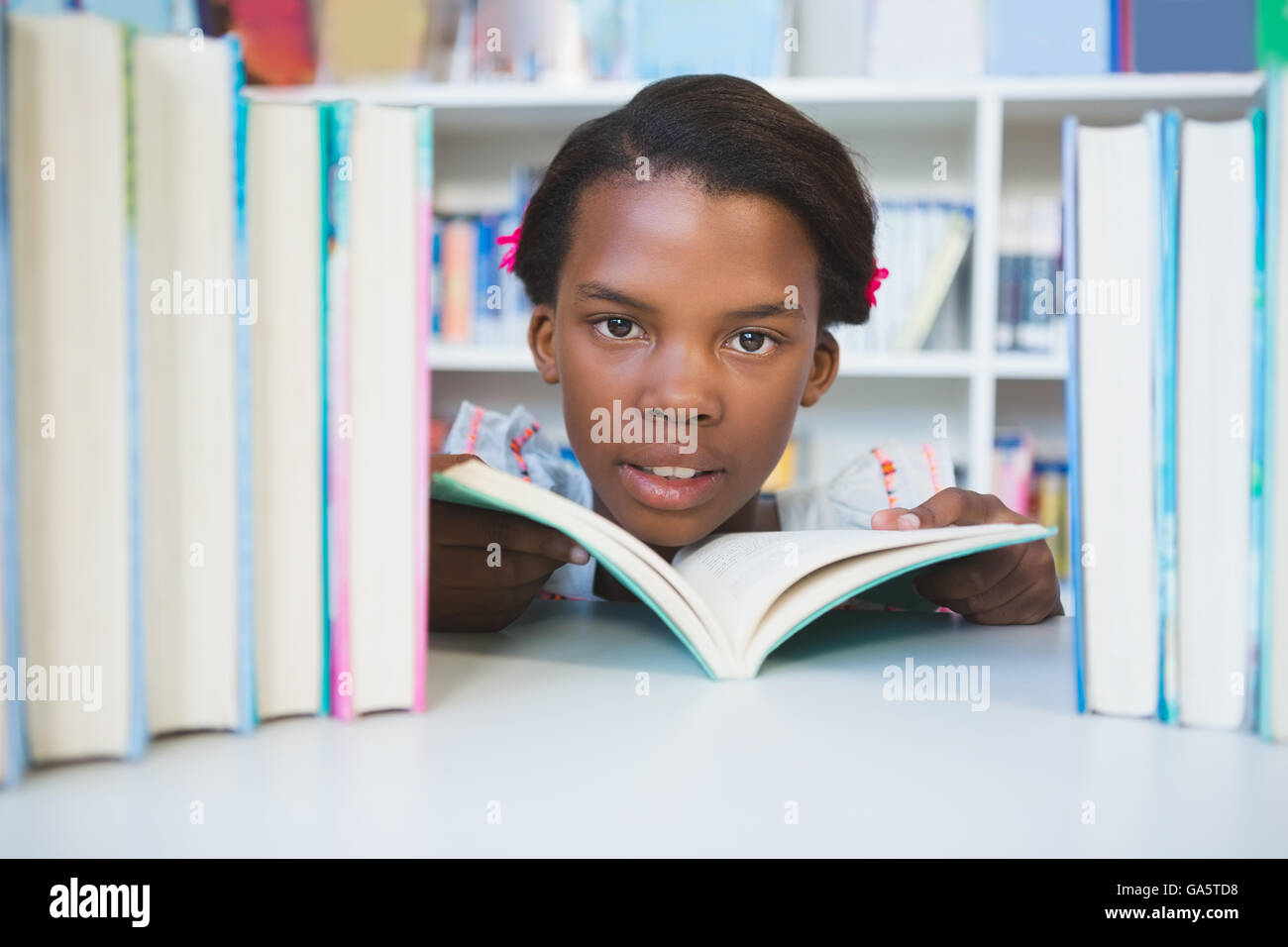 Black child reading book library hi-res stock photography and images ...