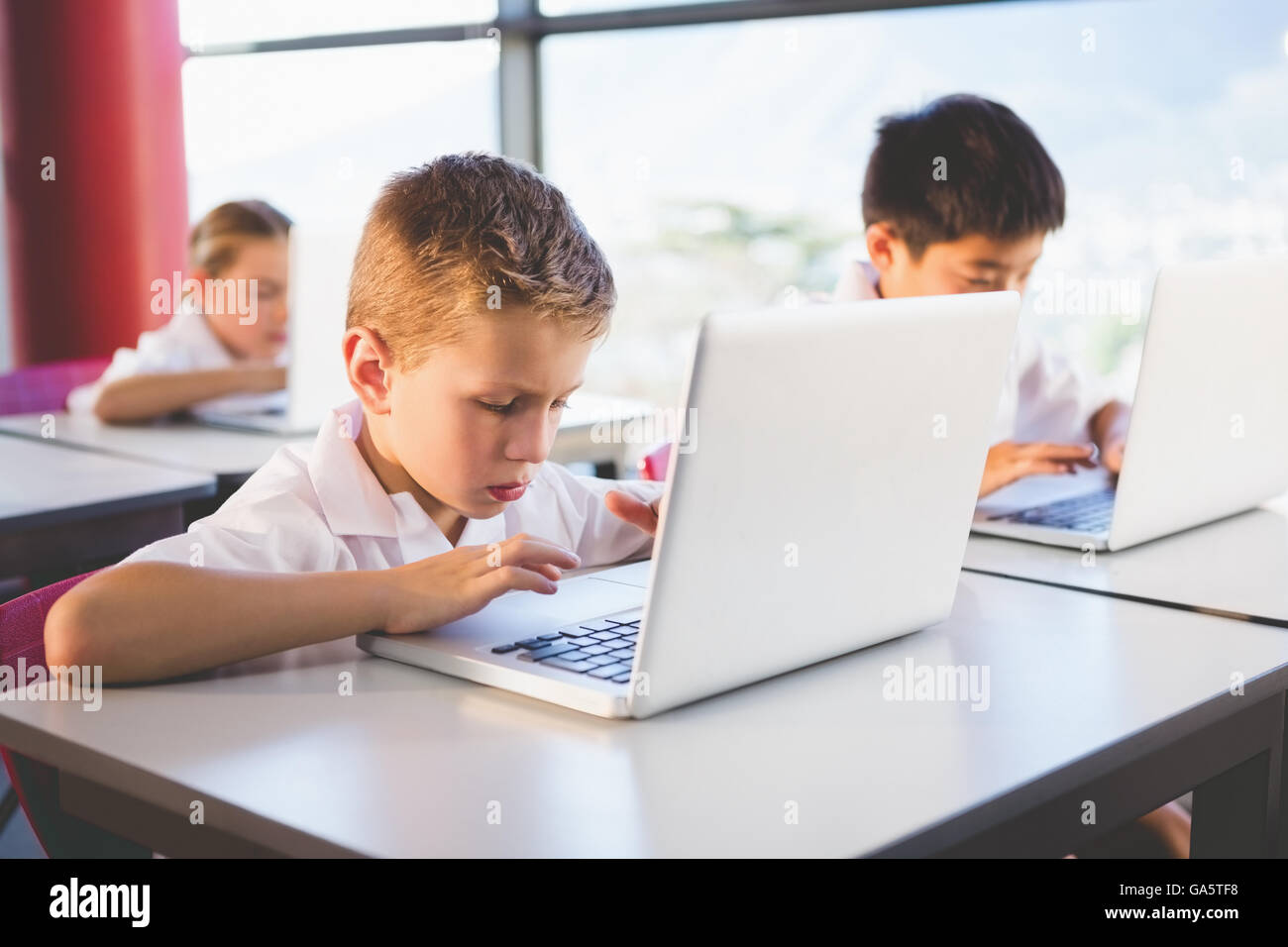 Child student laptop classroom desk hi-res stock photography and images ...