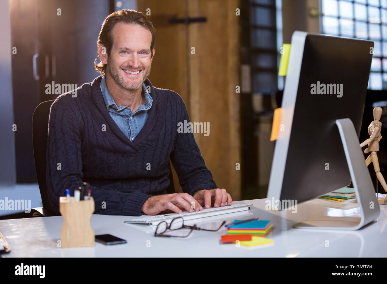 Happy man working pc hi-res stock photography and images - Alamy