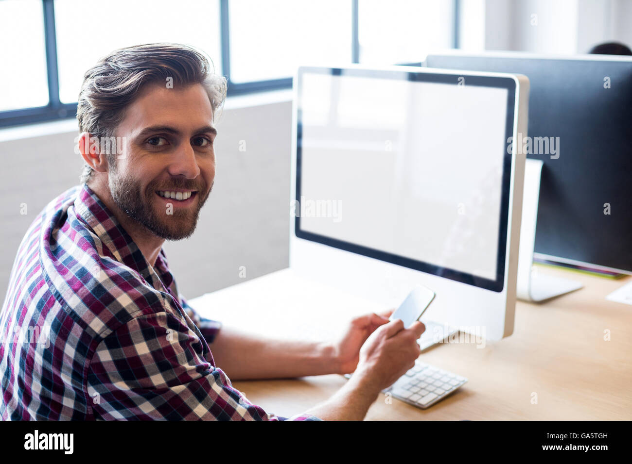 Mobile phone and computer and office hi-res stock photography and ...