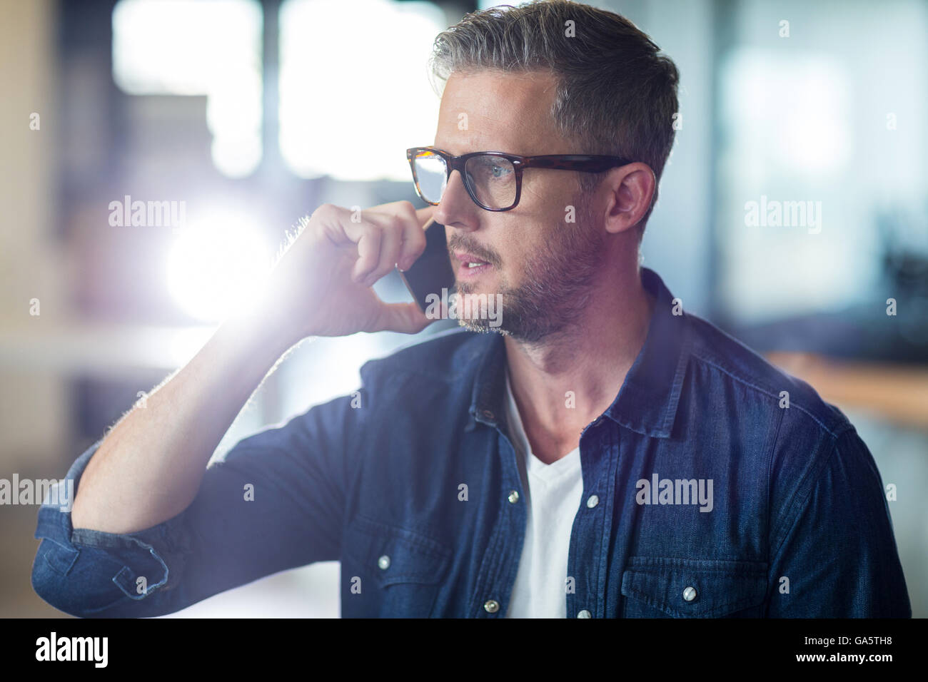 Man talking on phone Stock Photo - Alamy