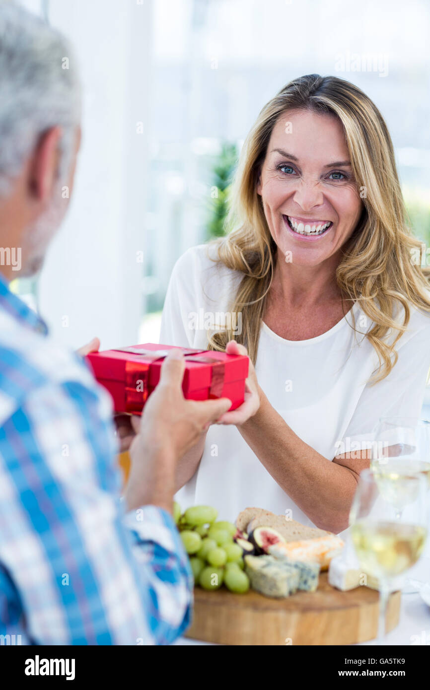 Husband giving gift to wife hi-res stock photography and images - Alamy