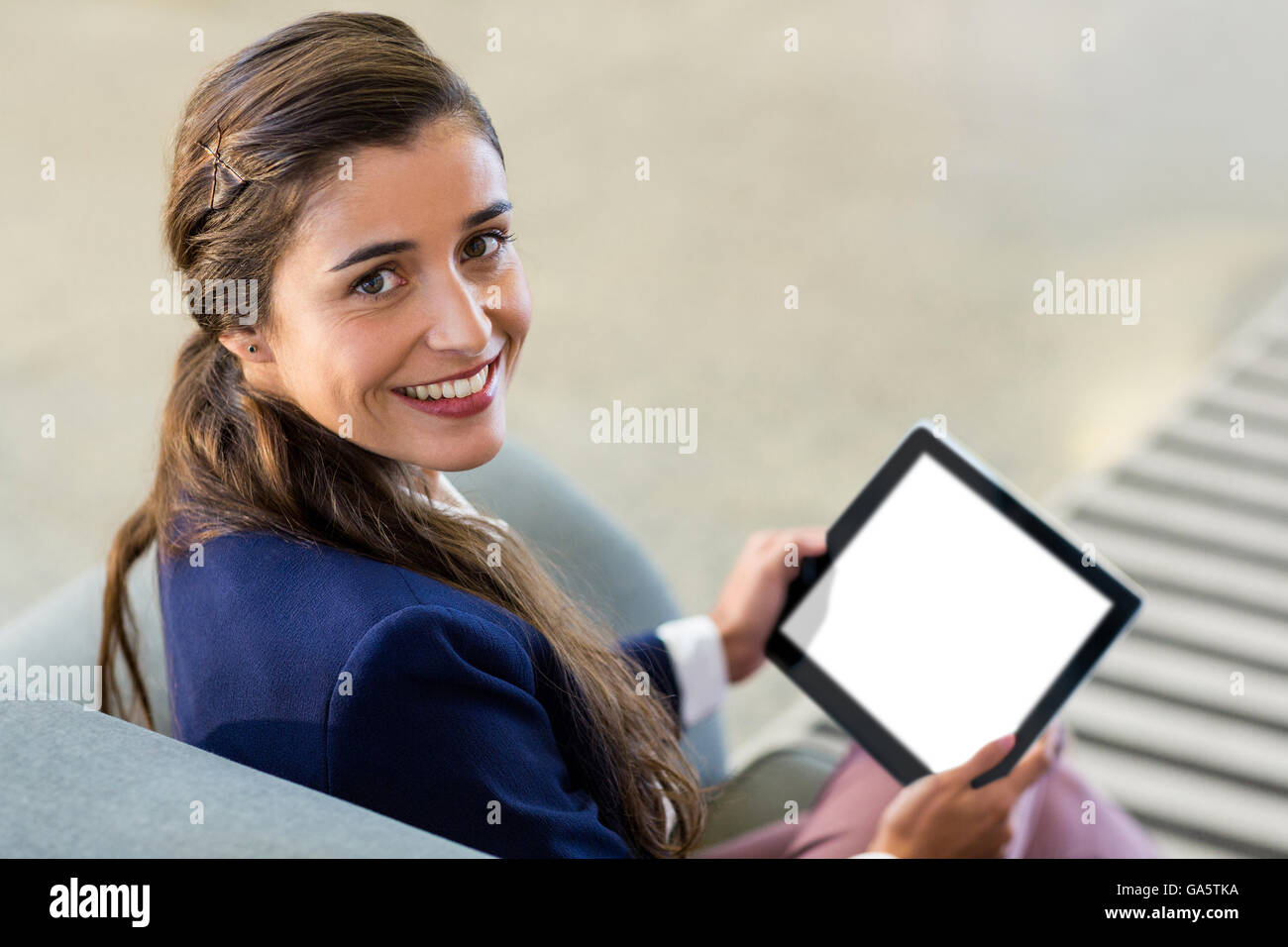 Portrait of happy woman holding digital tablet Stock Photo - Alamy