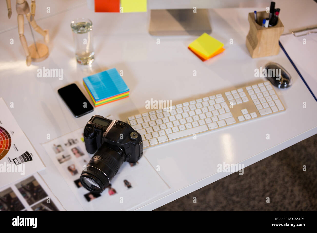 Camera by keyboard at desk Stock Photo - Alamy