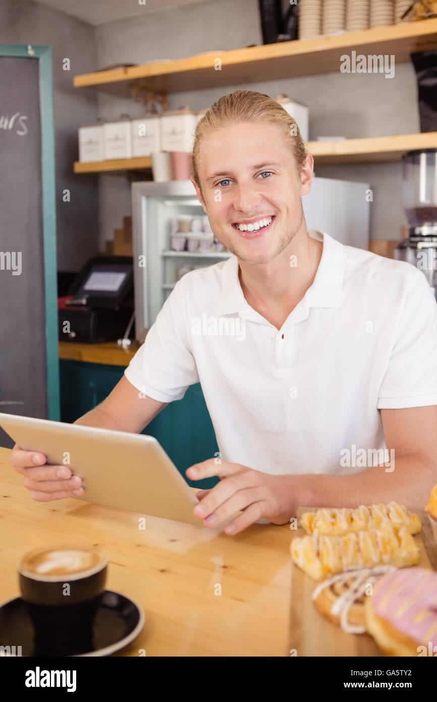 Waiter holding digital tablet Stock Photo - Alamy