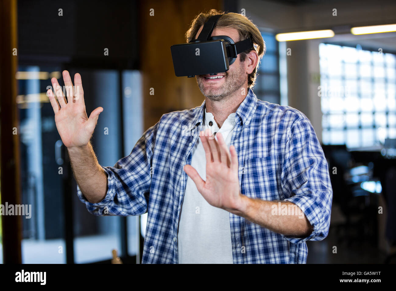 Businessman using virtual reality simulator Stock Photo - Alamy