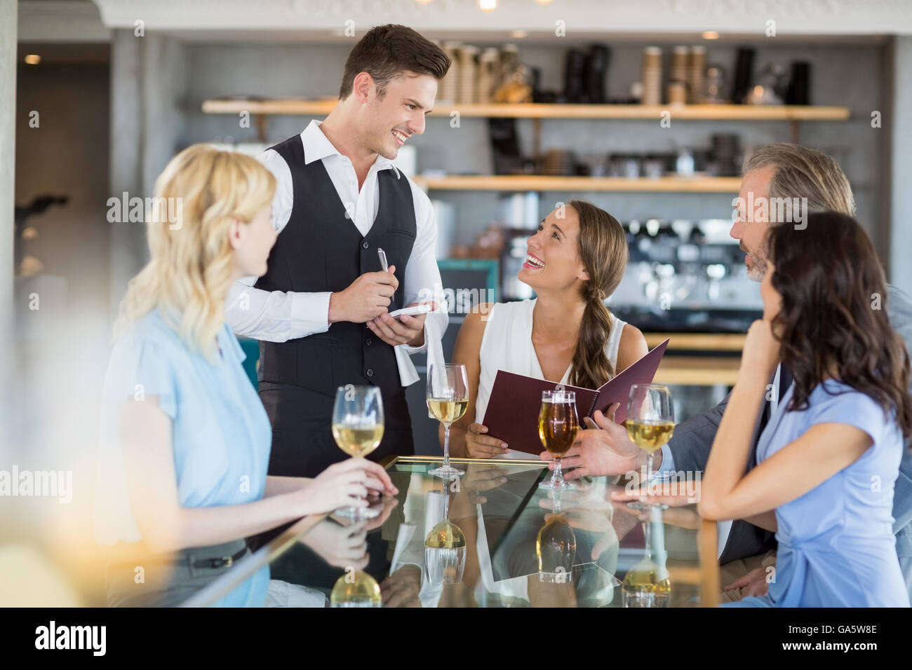 Man woman order restaurant waiter hi-res stock photography and images ...