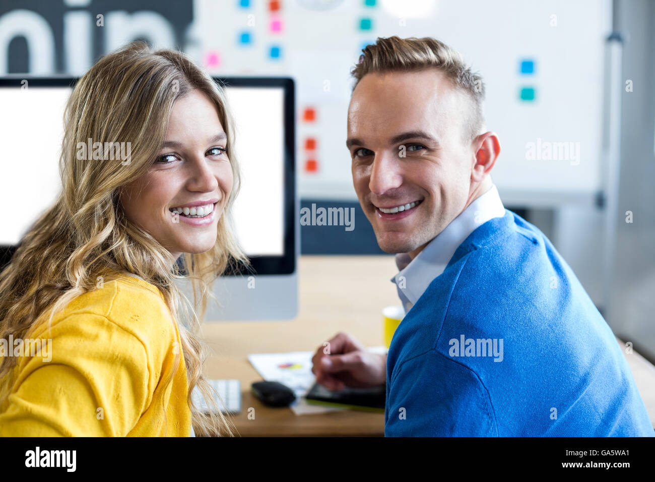 Portrait of smiling colleagues in office Stock Photo - Alamy