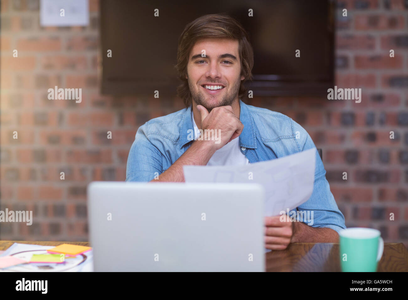 Young businessman looking document in hi-res stock photography and ...