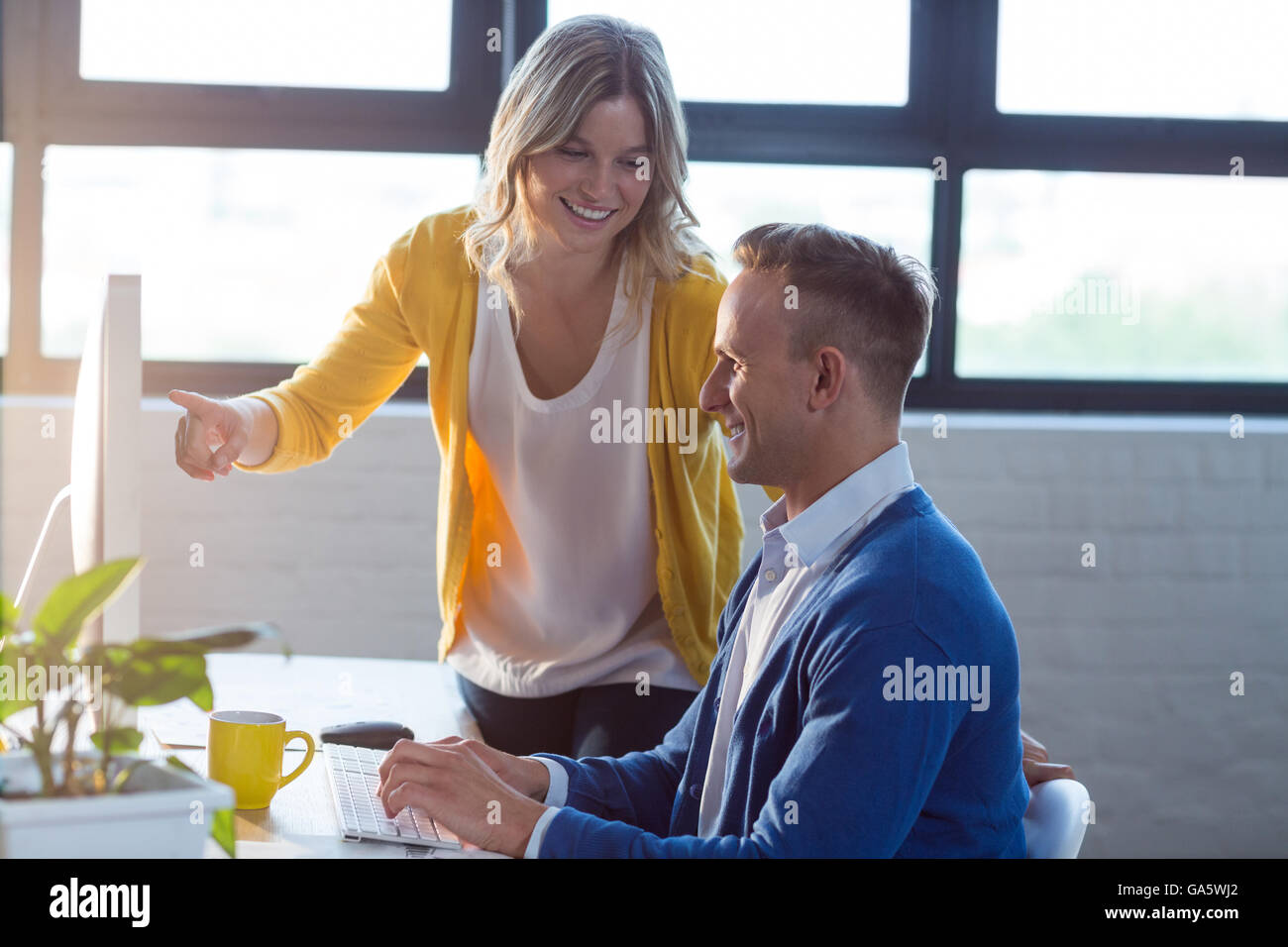 Colleagues talking window office hi-res stock photography and images ...