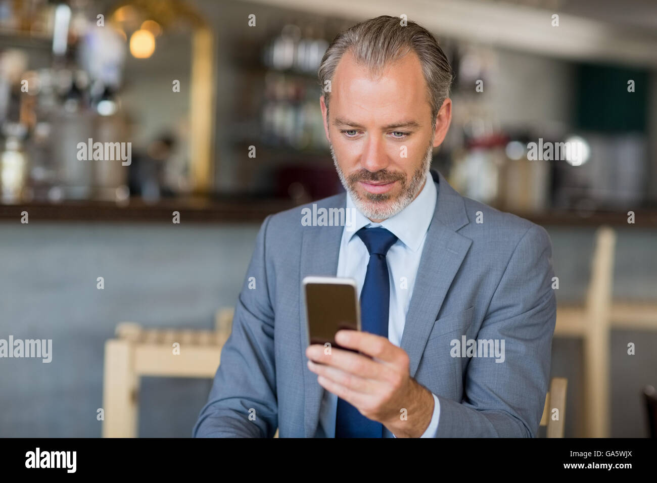 Businessman using mobile phone Stock Photo - Alamy