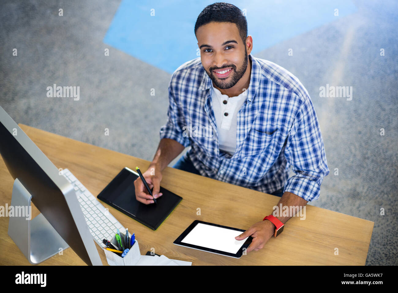 Businessman using digital tablets in office Stock Photo - Alamy