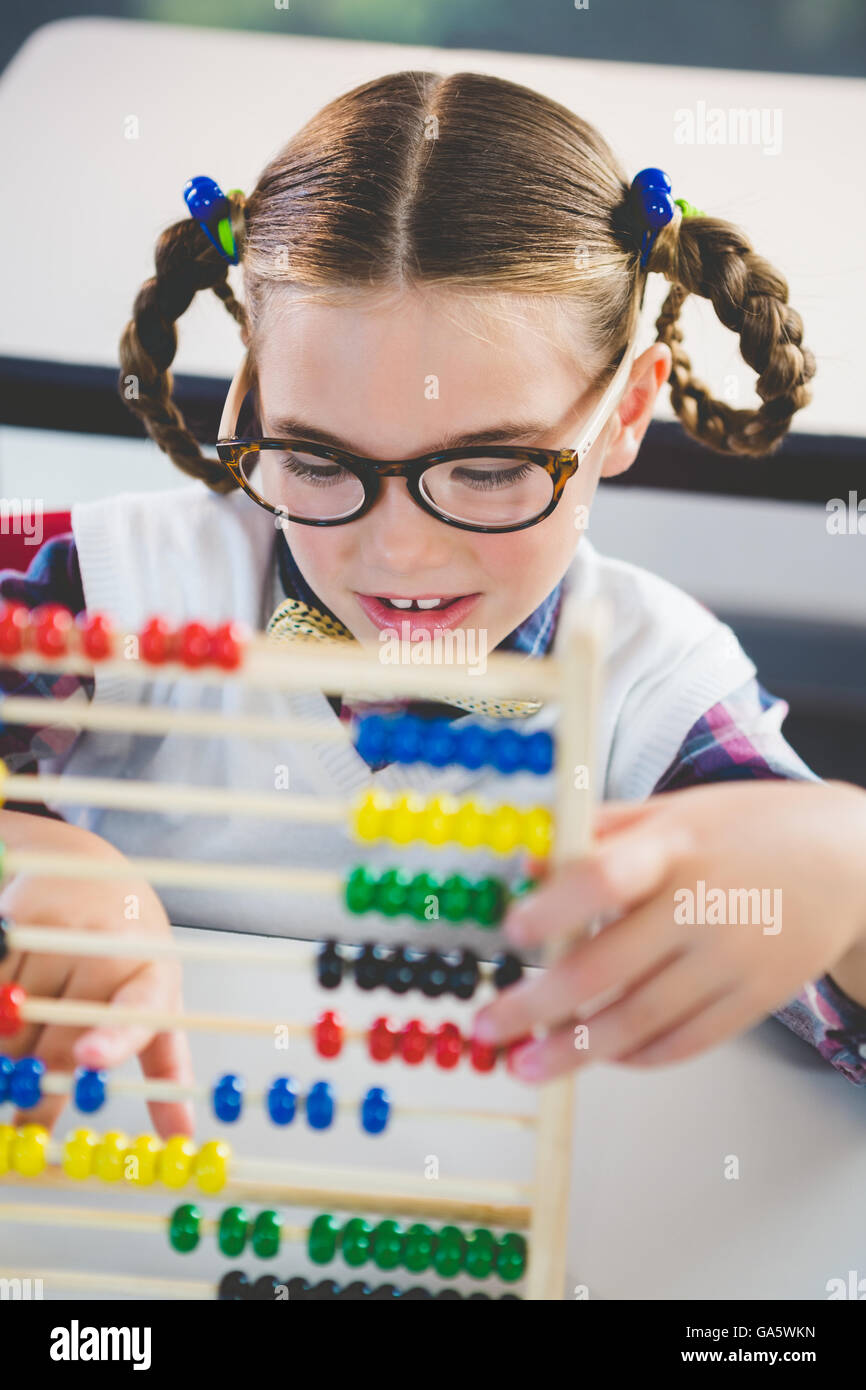 Close-up of schoolkid counting abacus in classroom Stock Photo - Alamy