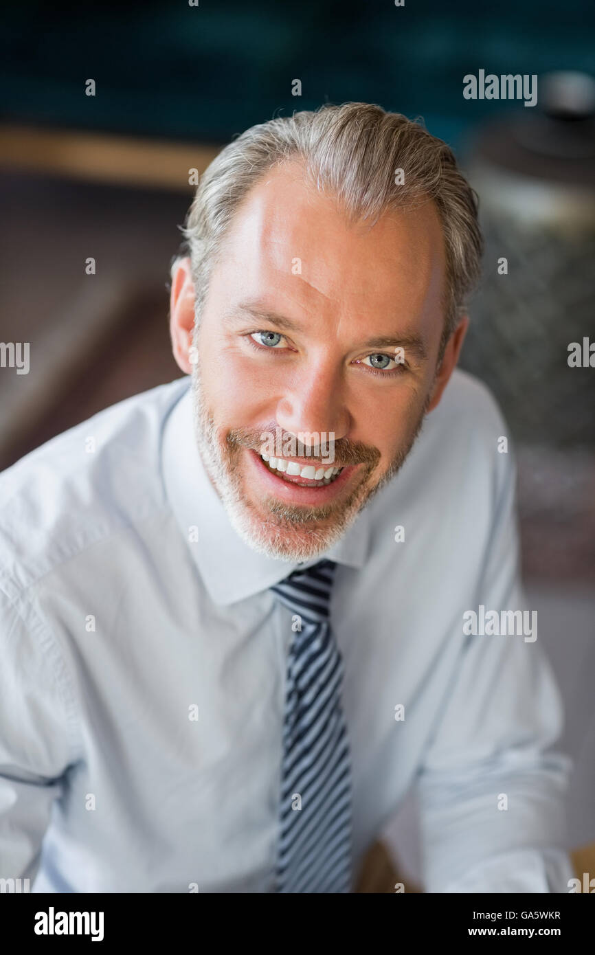 Portrait of smiling businessman Stock Photo - Alamy