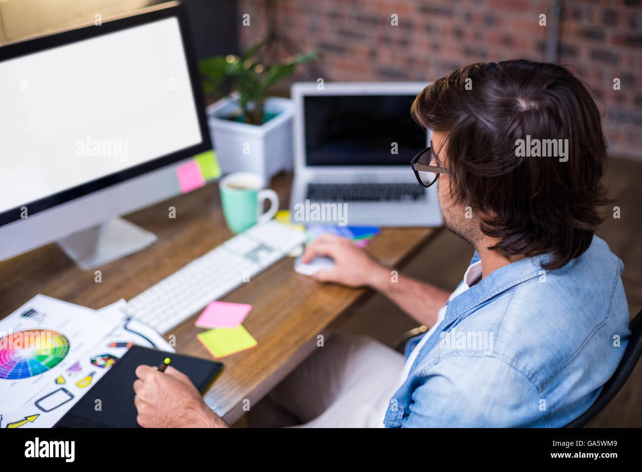 Man working in creative office Stock Photo - Alamy