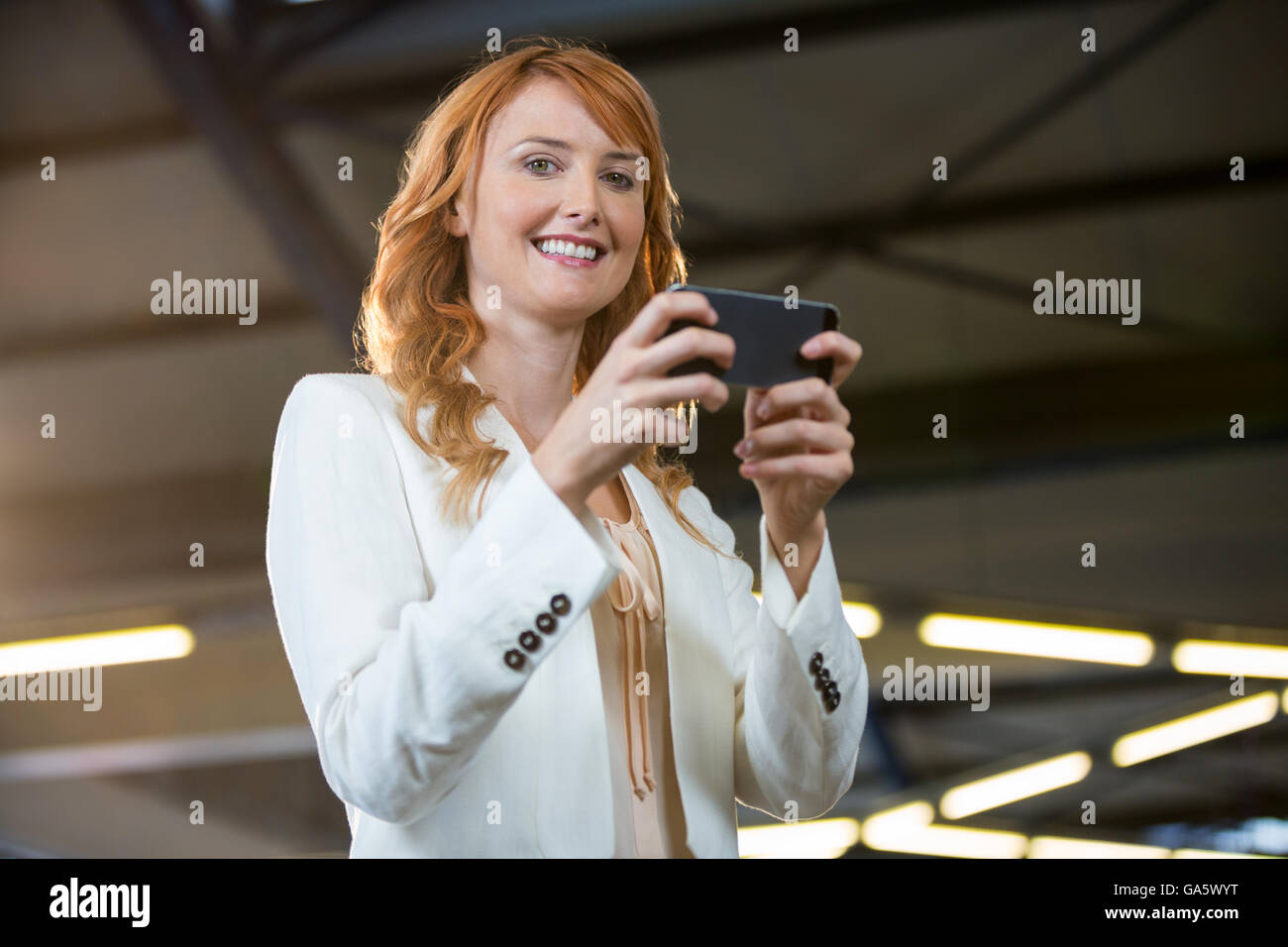 Pretty adult female using smart hi-res stock photography and images - Alamy