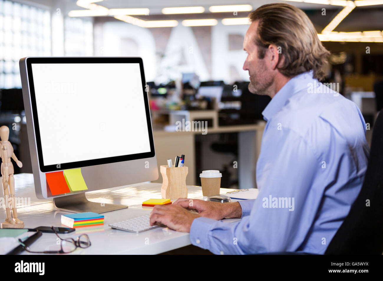 Businessman working on computer Stock Photo - Alamy