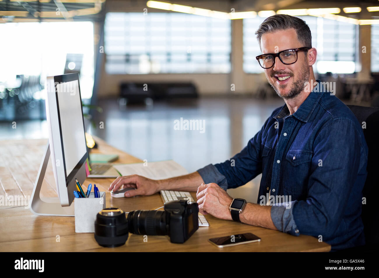 Portrait of man using computer Stock Photo - Alamy
