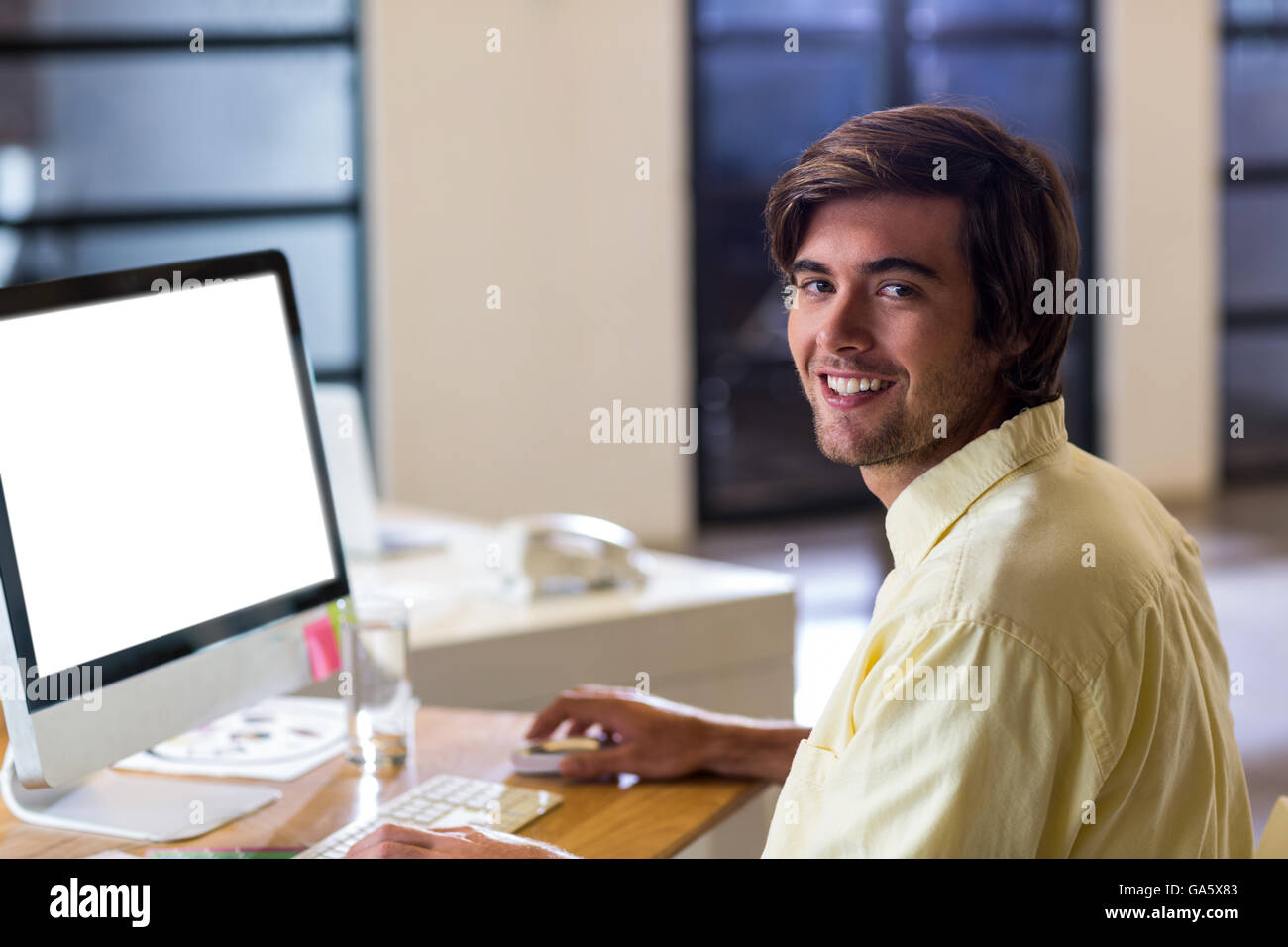 Cheerful businessman working computer hi-res stock photography and ...