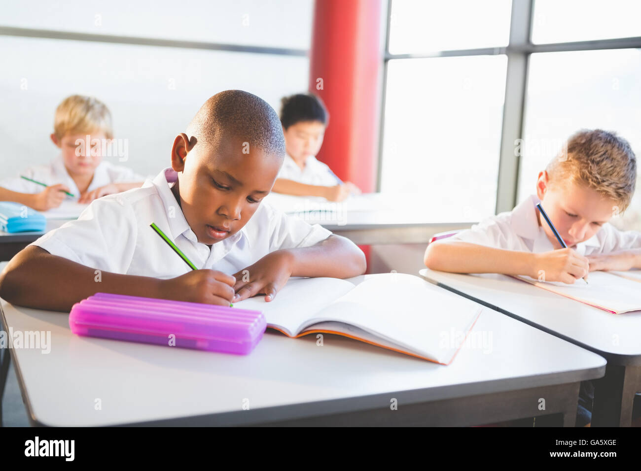 Kids doing homework table hi-res stock photography and images - Alamy