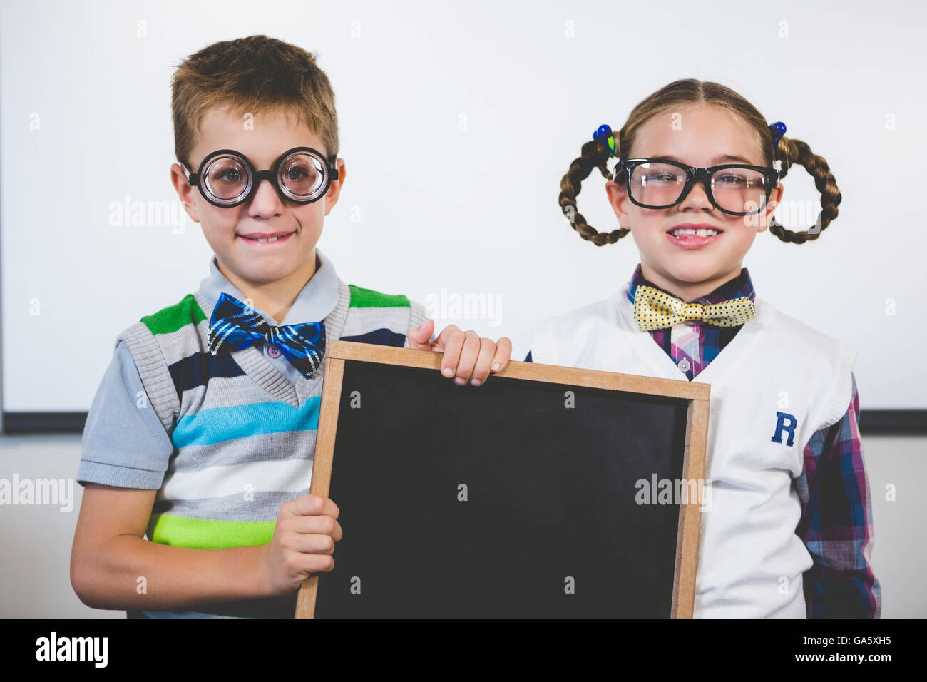 Smiling school kids in hi-res stock photography and images - Alamy