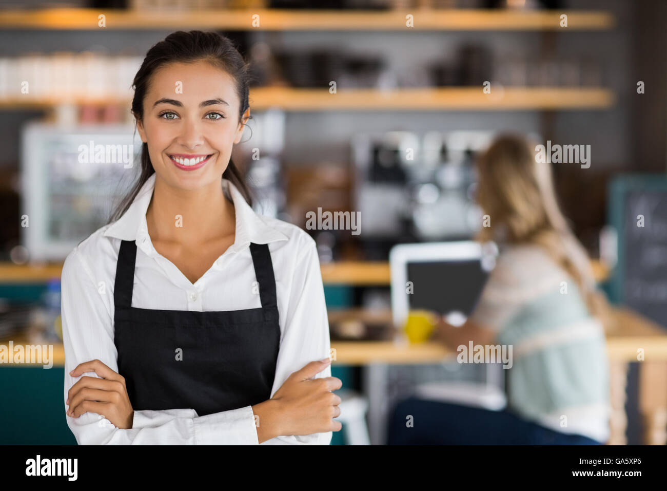 Portrait confident waitress standing counter hi-res stock photography ...