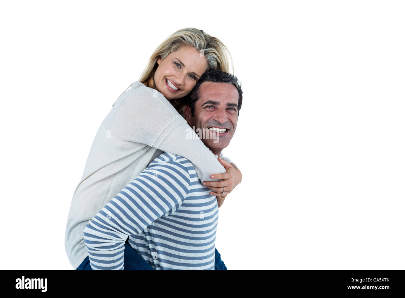 Portrait of man carrying woman piggyback Stock Photo - Alamy