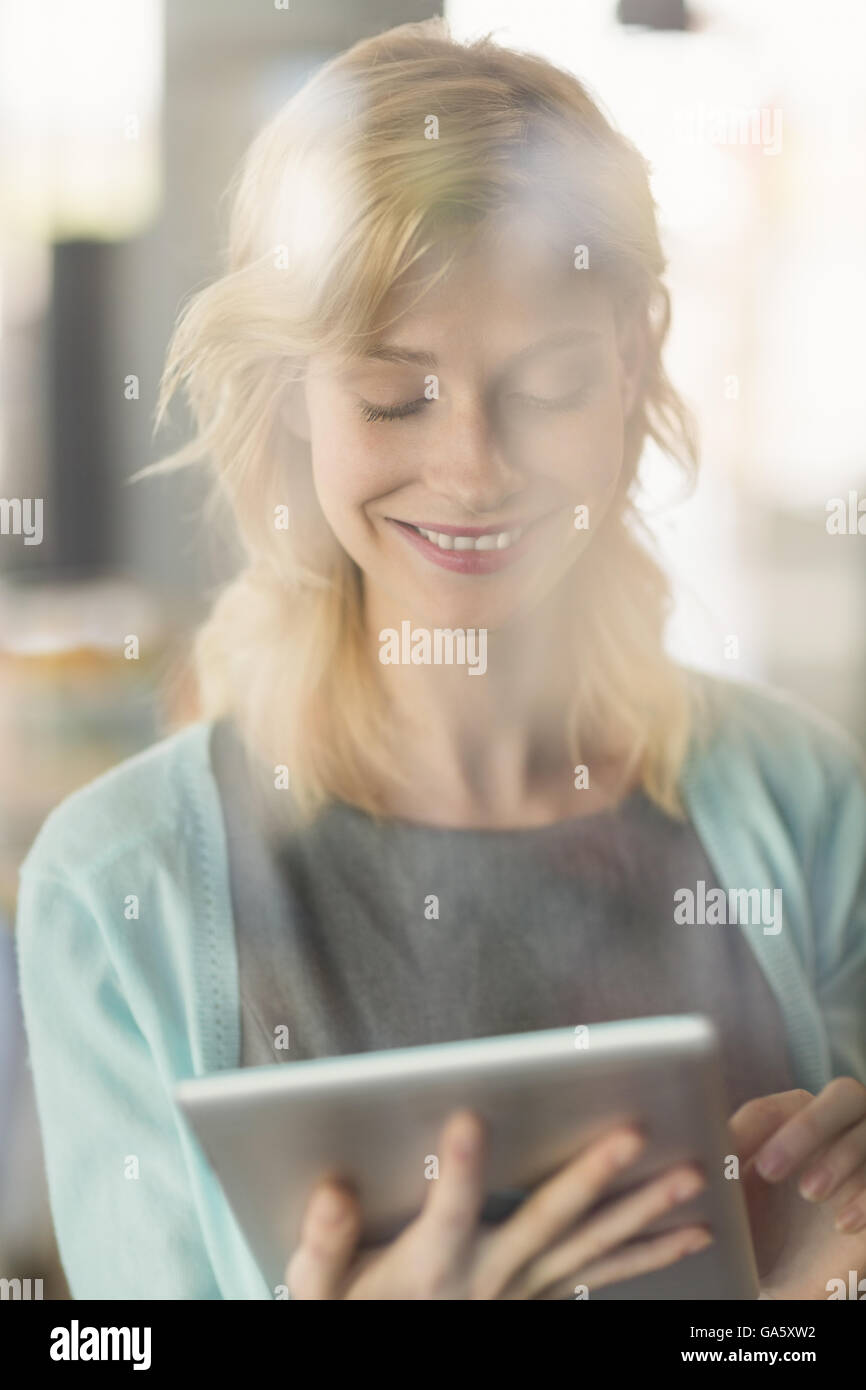 Woman standing up using tablet hi-res stock photography and images - Alamy