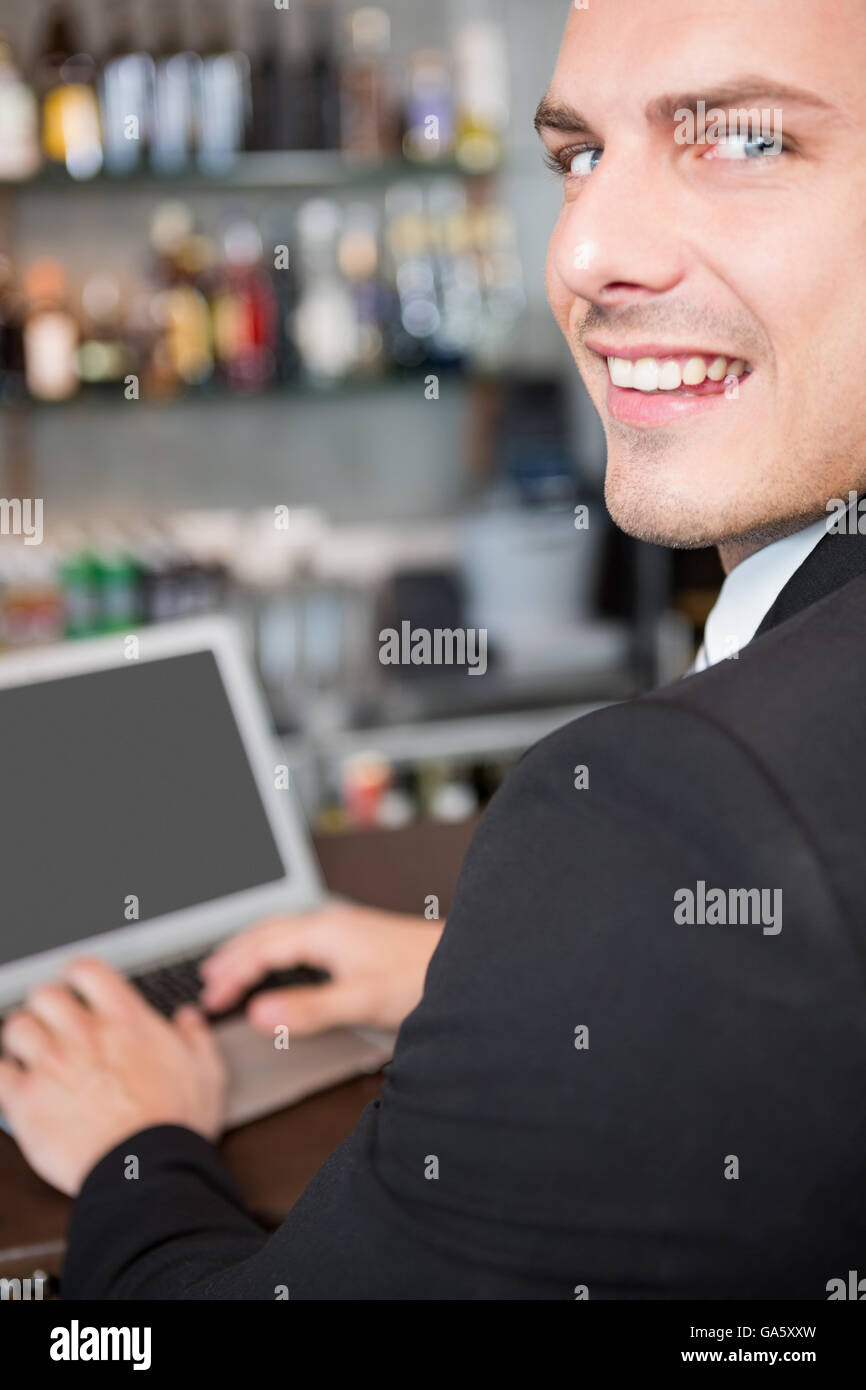 Businessman using laptop in restaurant Stock Photo - Alamy