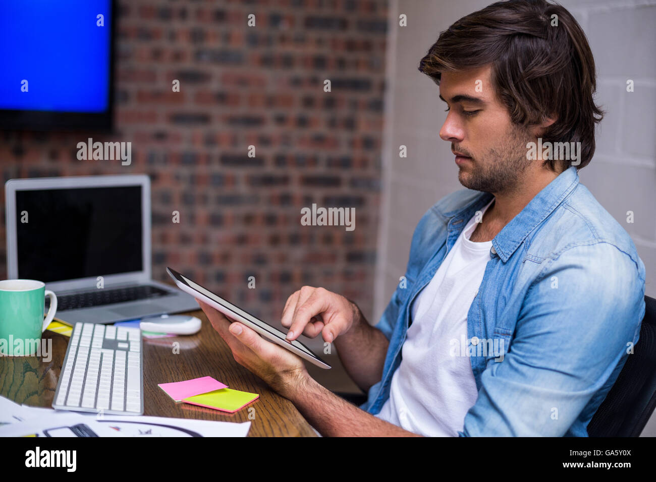 Adult businessman using digital hi-res stock photography and images - Alamy