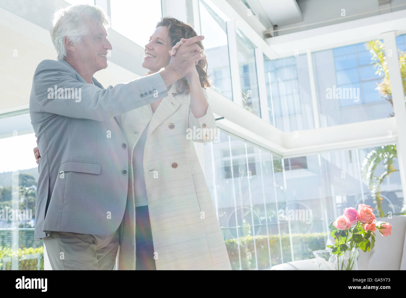 Smiling couple dancing Stock Photo - Alamy