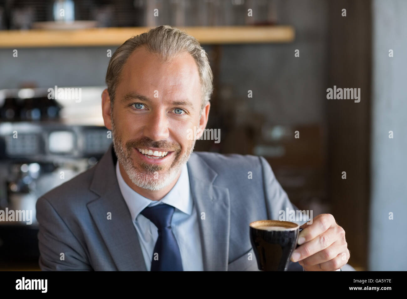Professional businessman having coffee hi-res stock photography and ...