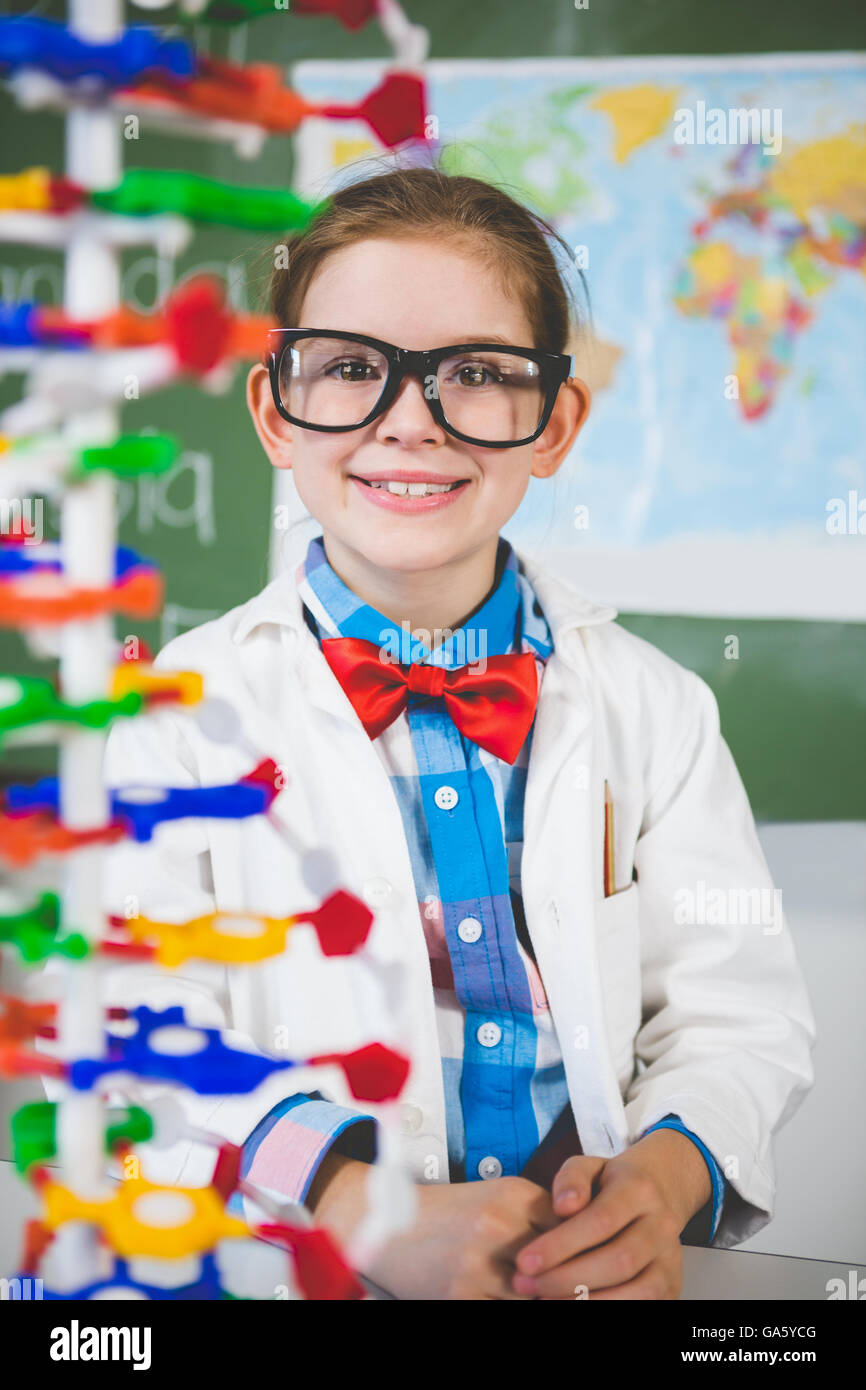 School girl assembling molecule model for science project in lab Stock ...
