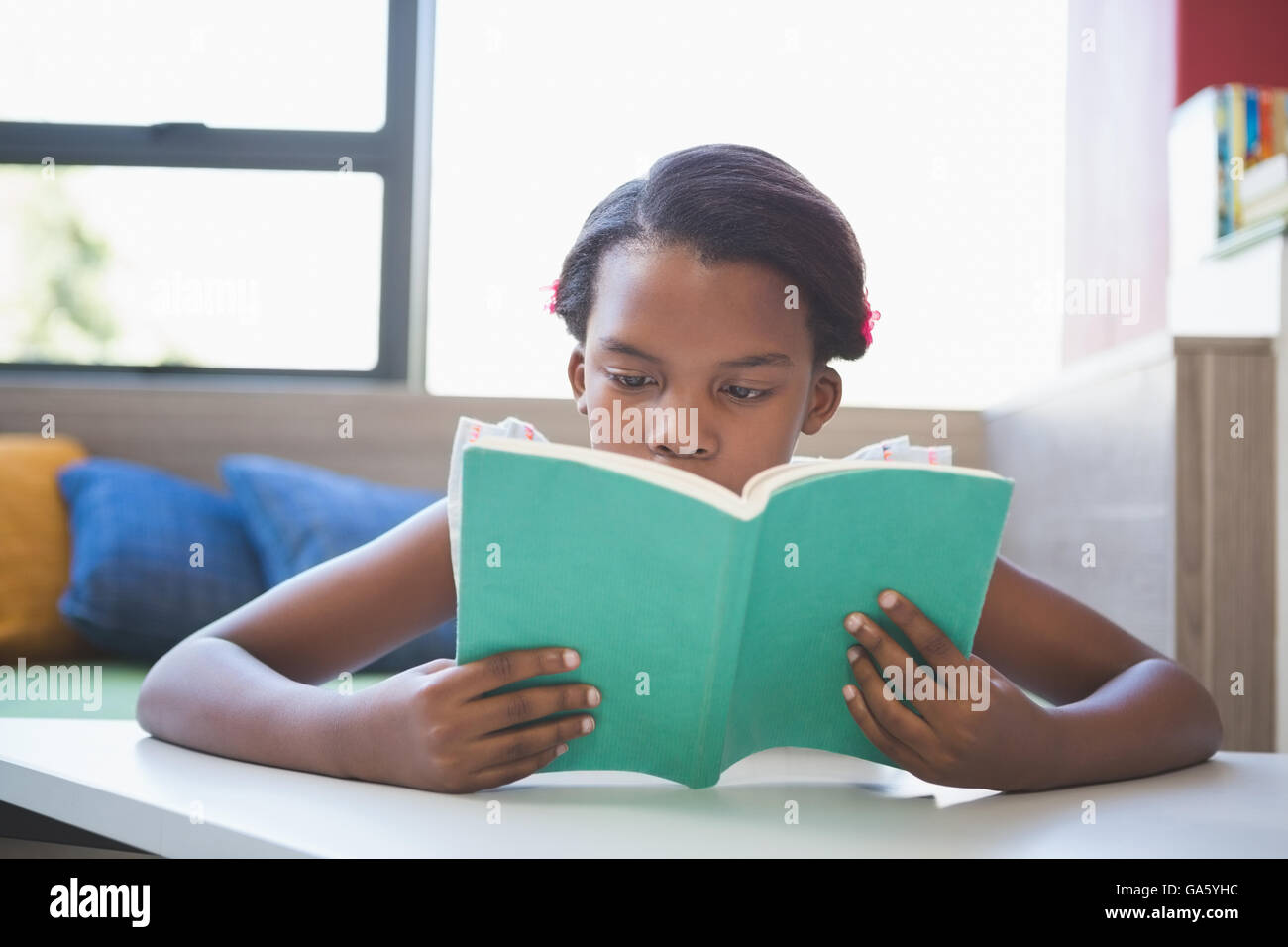 Black child reading book library hi-res stock photography and images ...