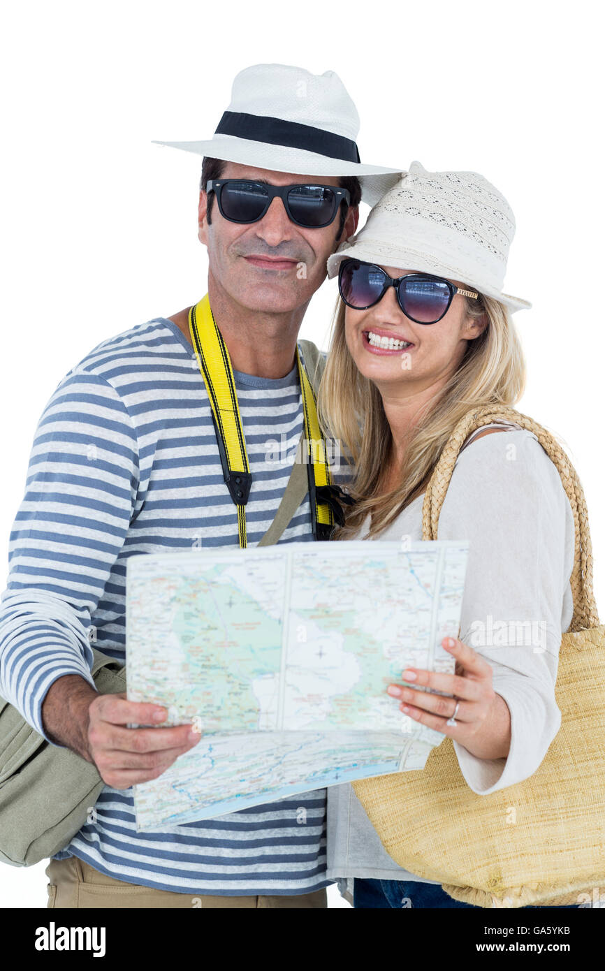 Portrait of mid adult couple holding map Stock Photo - Alamy