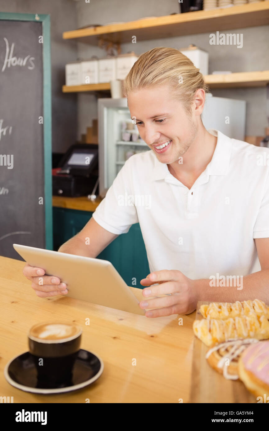 Waiter using digital tablet Stock Photo - Alamy